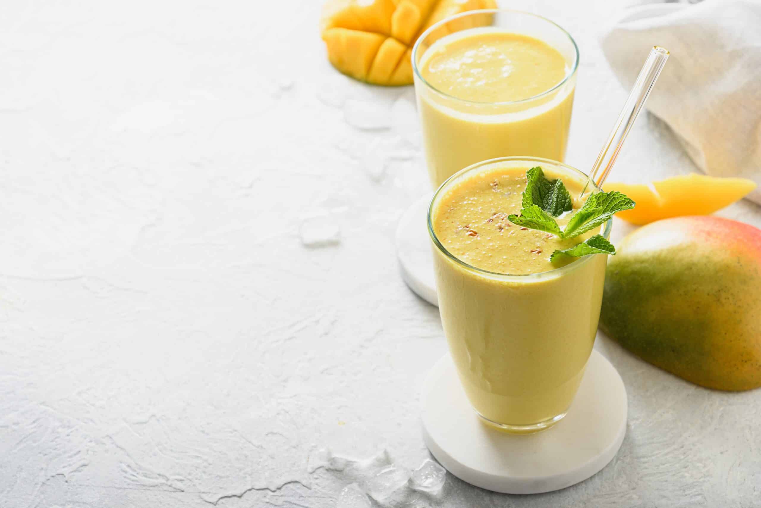 Indian mango or turmeric lassi on gray background - Mississippi Market ...